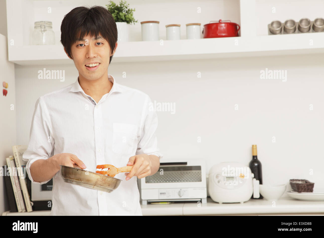 Japanese man cooking Stock Photo - Alamy