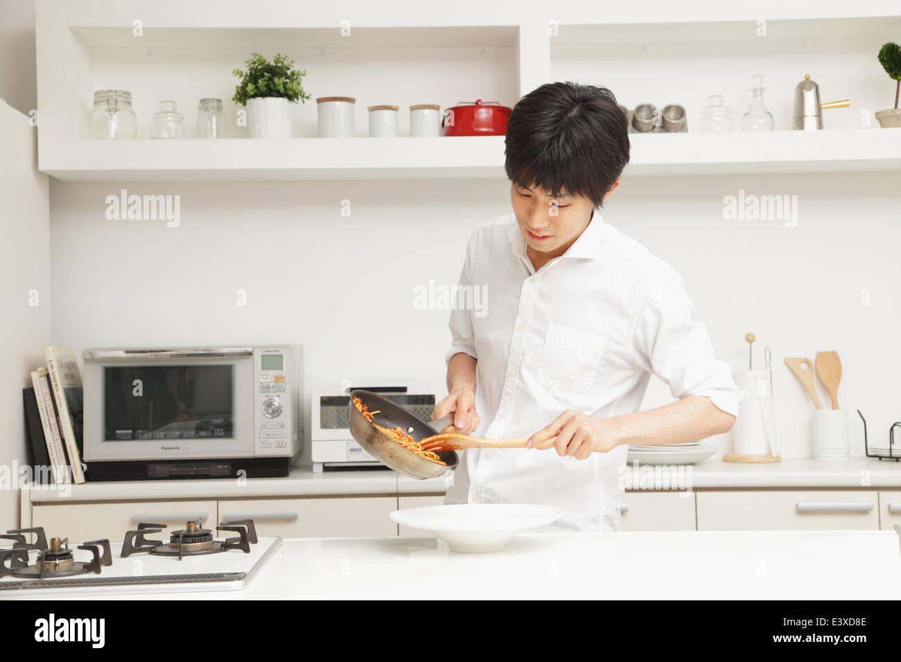 Japanese man cooking Stock Photo - Alamy