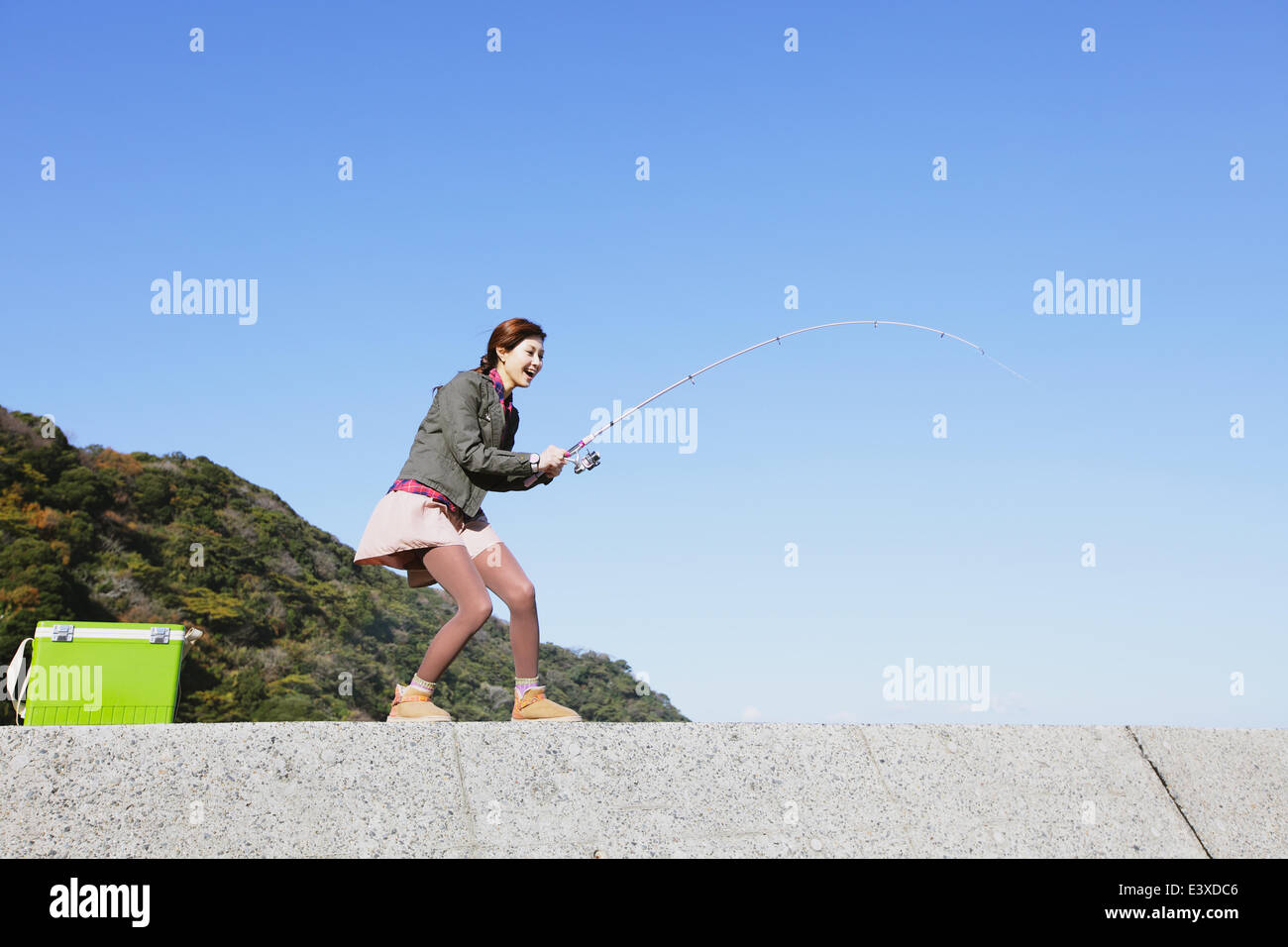 Japanese woman fishing Stock Photo - Alamy