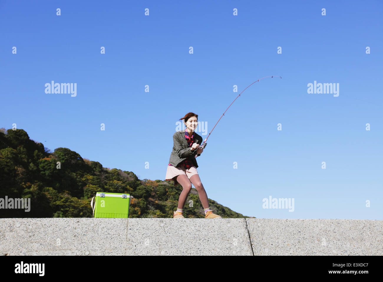 Japanese woman fishing Stock Photo - Alamy