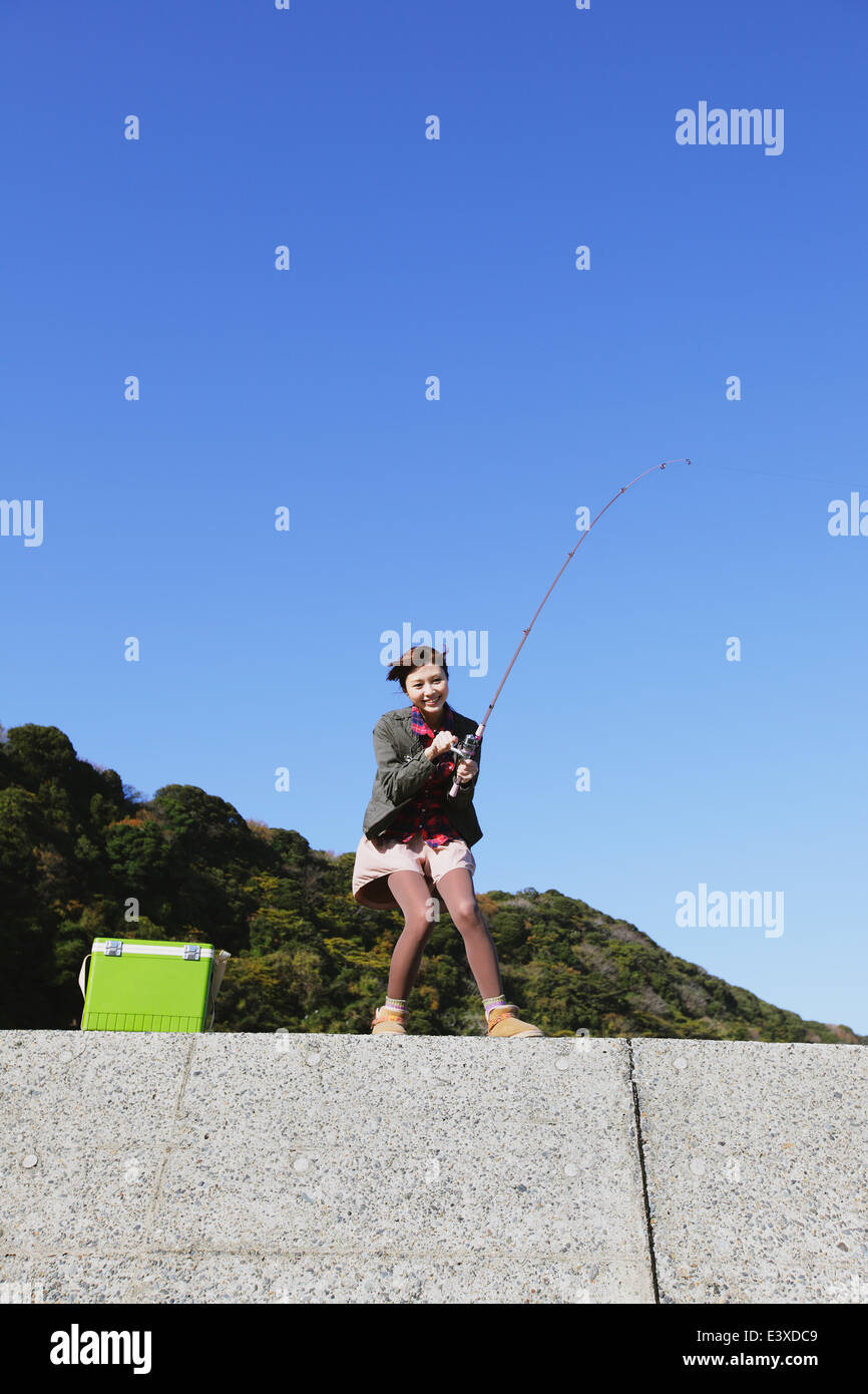 Japanese woman fishing Stock Photo - Alamy