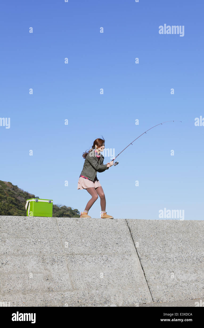 Japanese woman fishing Stock Photo - Alamy