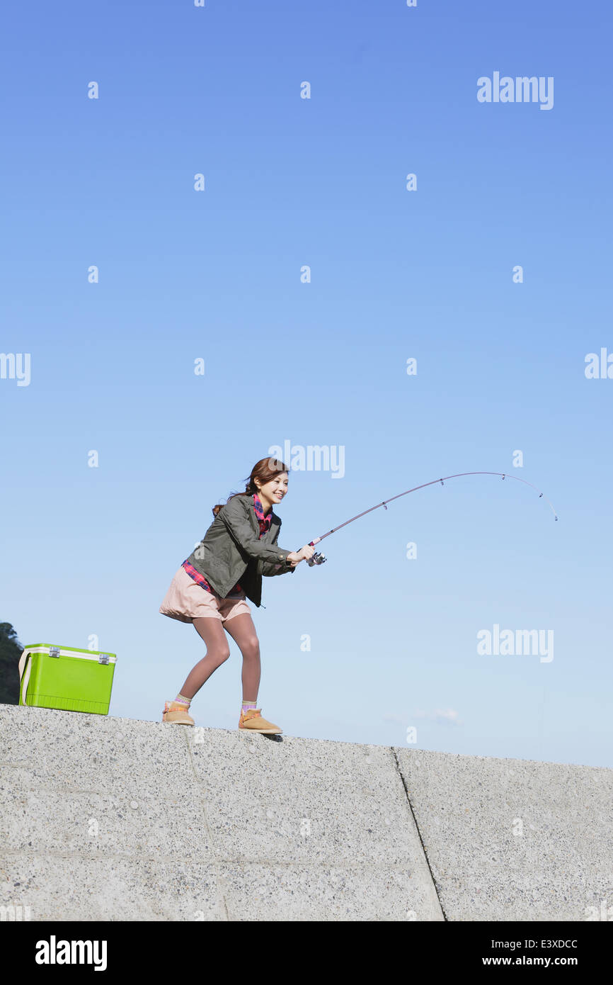 Japanese woman fishing Stock Photo - Alamy