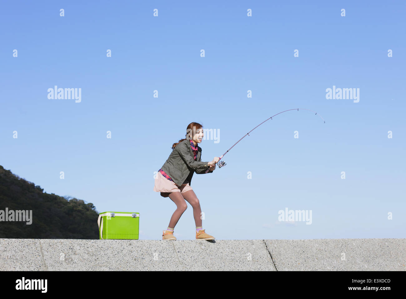 Japanese woman fishing Stock Photo - Alamy
