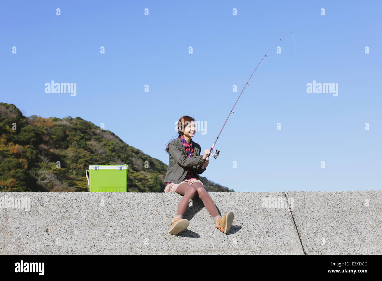 Japanese woman fishing Stock Photo - Alamy