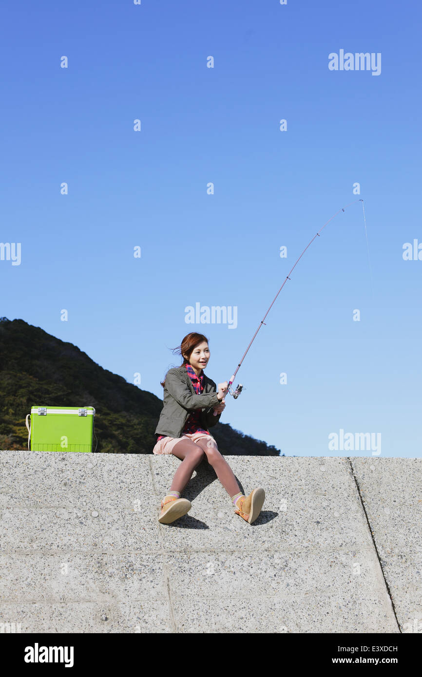 Japanese woman fishing Stock Photo - Alamy