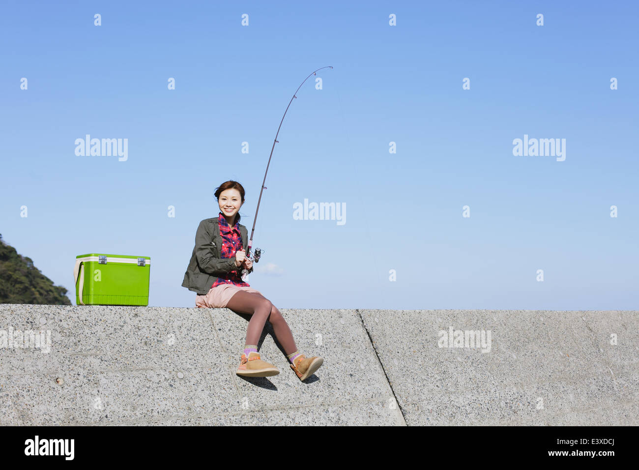 Japanese woman fishing Stock Photo - Alamy