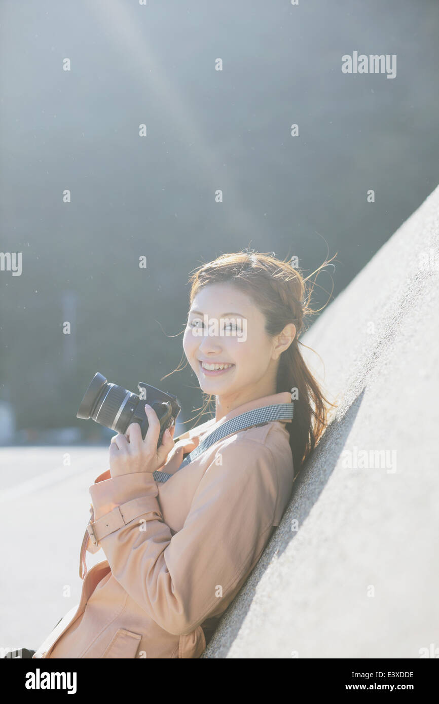 Portrait of Japanese woman with camera smiling Stock Photo - Alamy