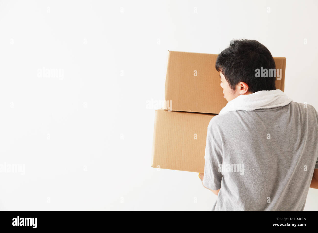 Man lifting heavy boxes hi-res stock photography and images - Alamy