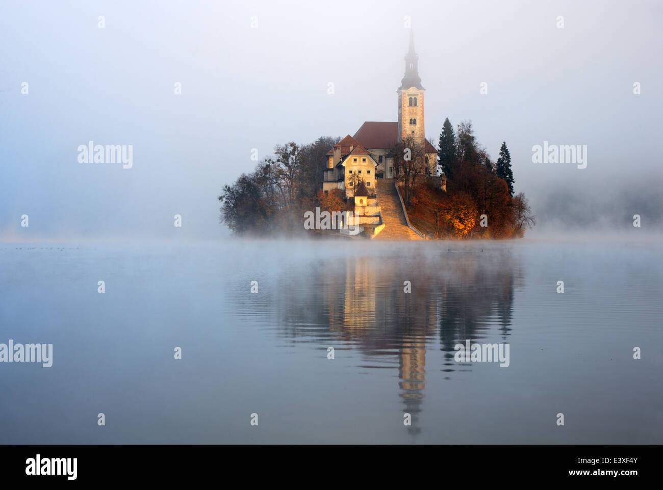 The famous Island church emerging as the morning sun breaks through an ...