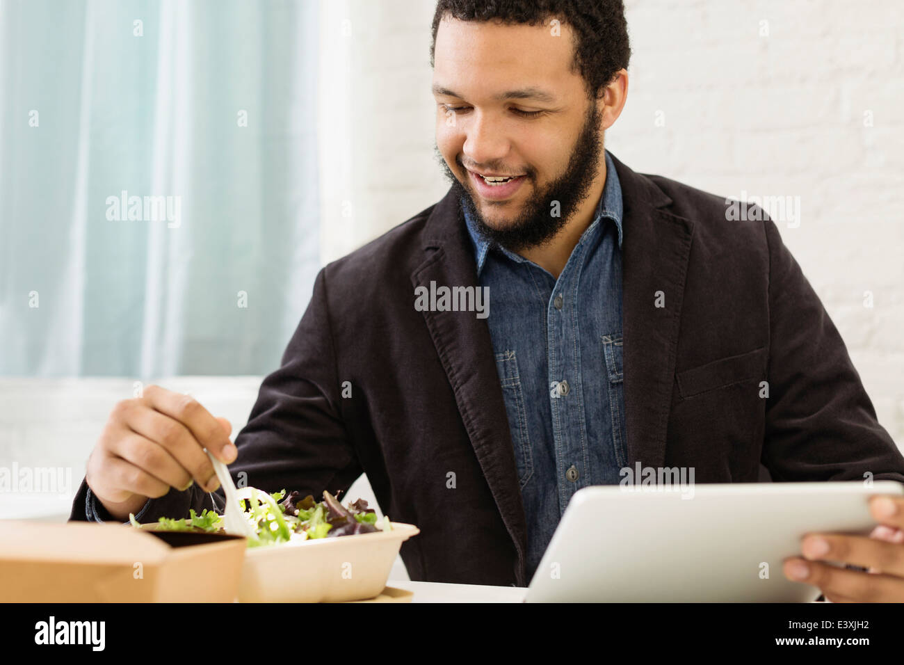 African man eating salad hi-res stock photography and images - Alamy