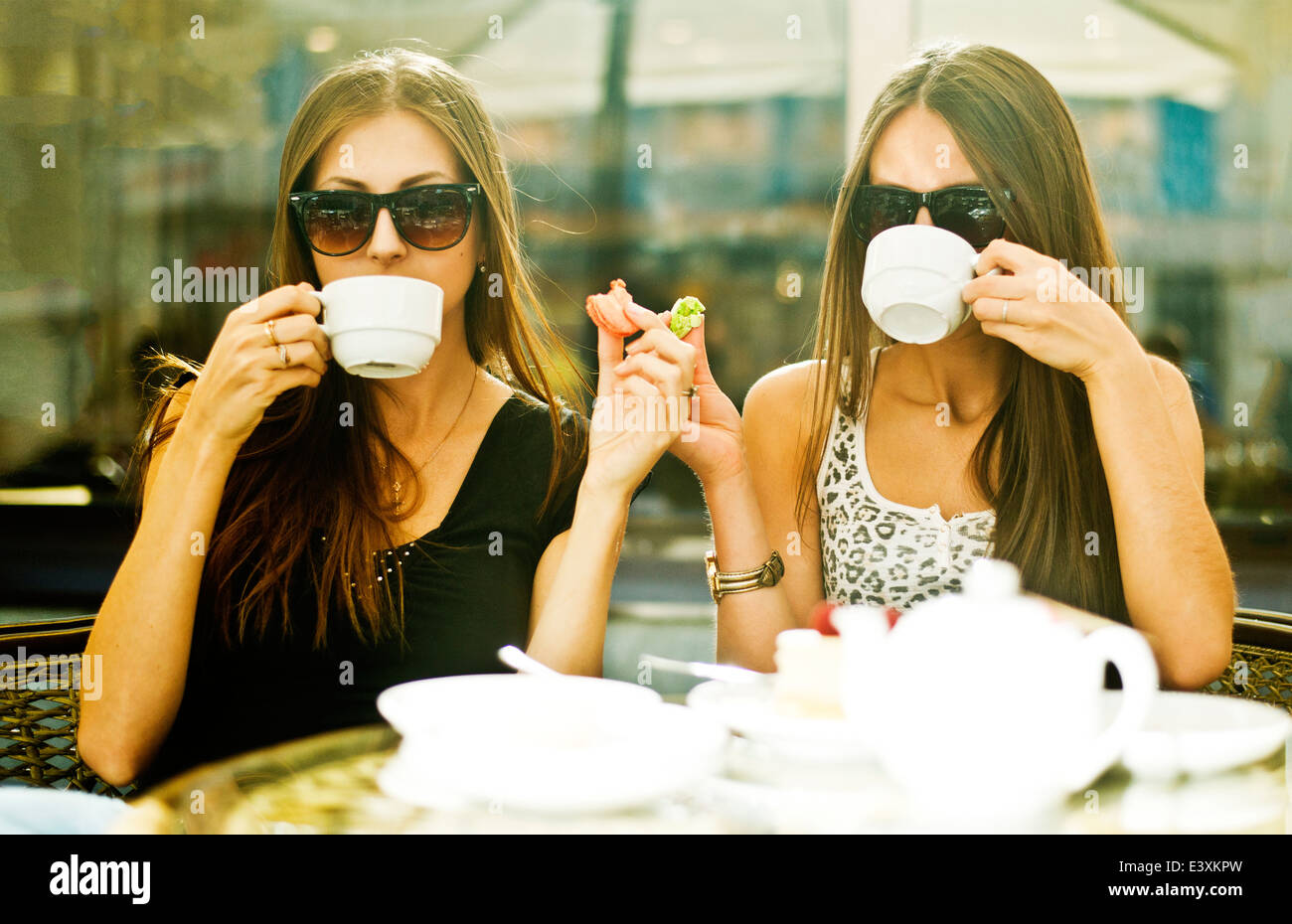 Two women having tea at cafe hi-res stock photography and images - Alamy