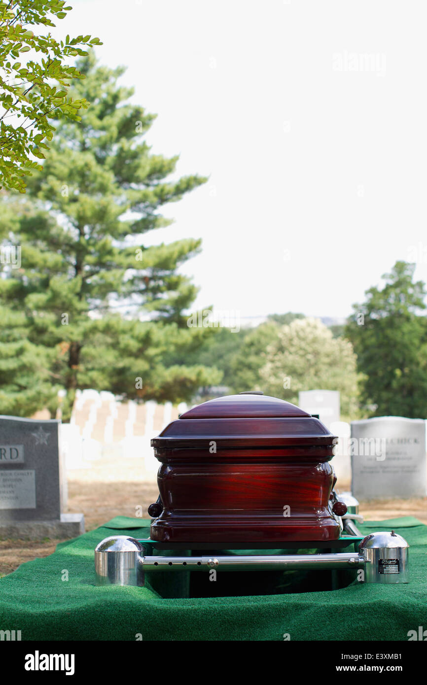 Coffin lowering into grave in military cemetery, Arlington, Virginia ...
