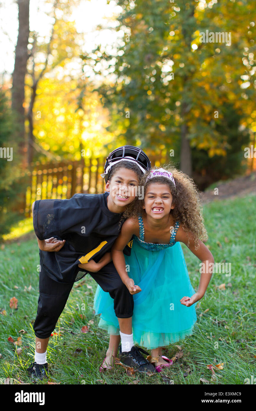 Mixed race children playing together outdoors Stock Photo - Alamy