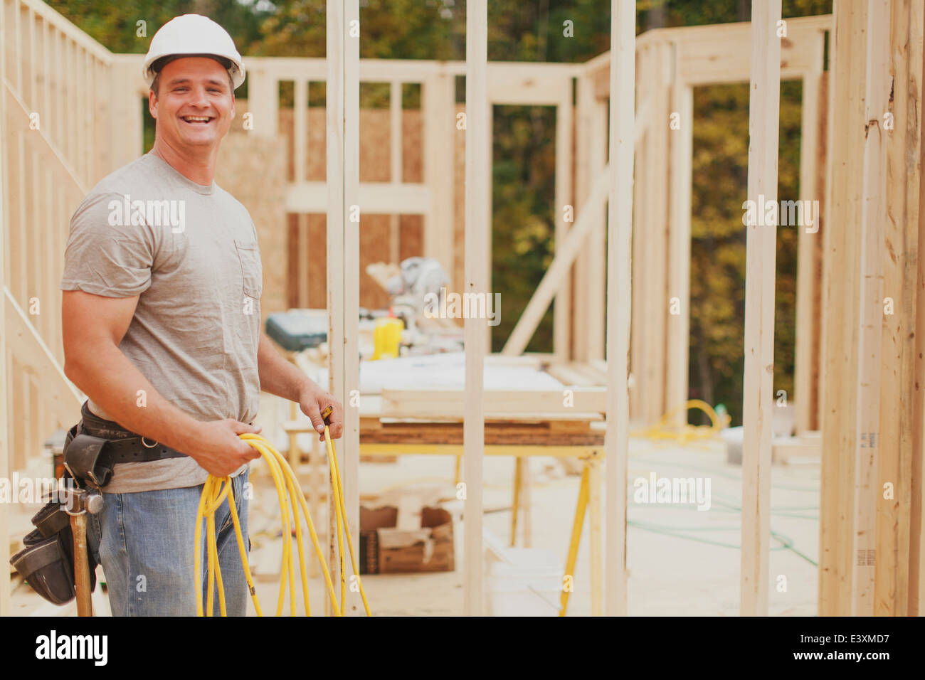 Caucasian construction worker smiling on site Stock Photo - Alamy