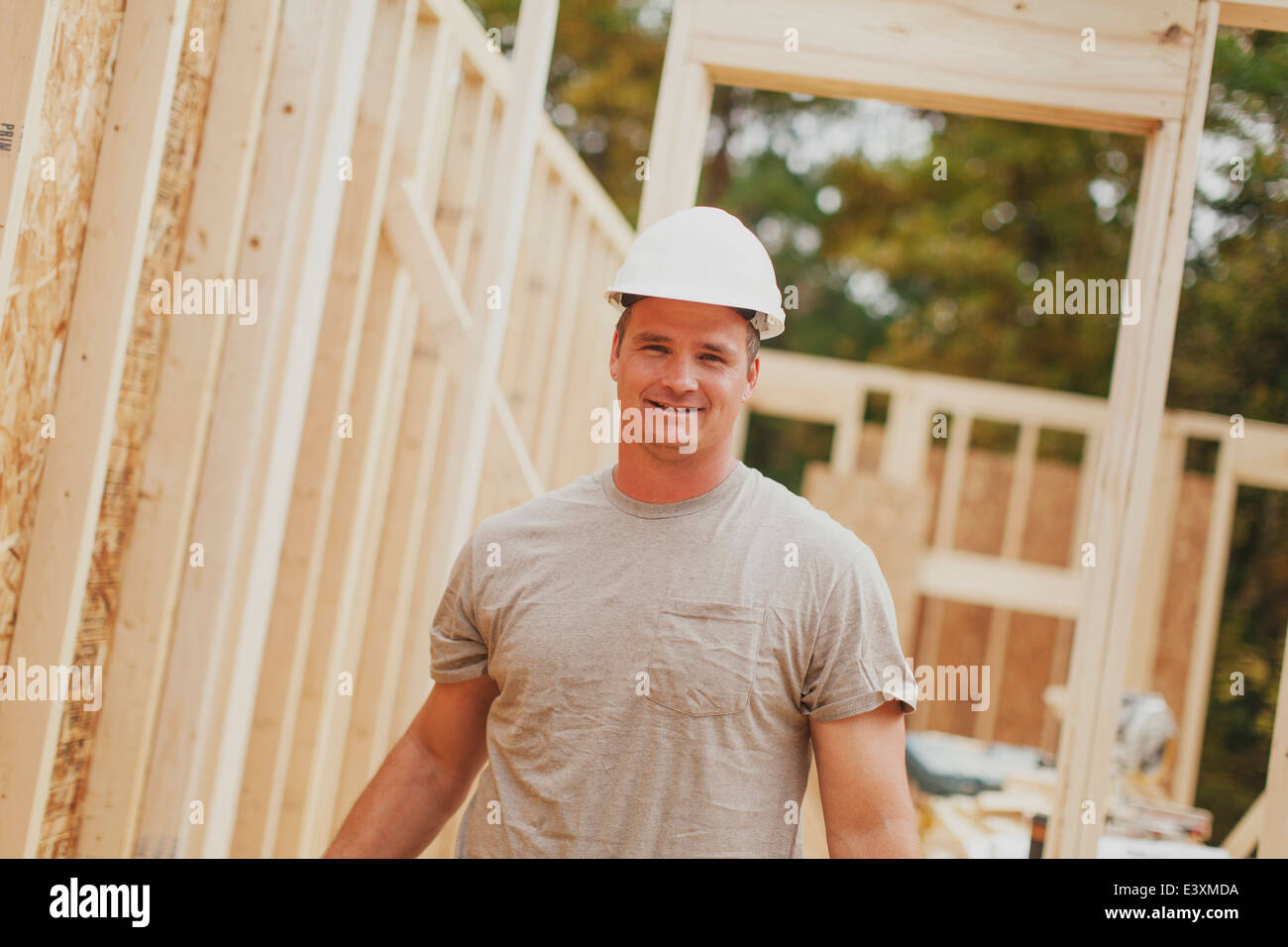 Caucasian construction worker smiling on site Stock Photo - Alamy