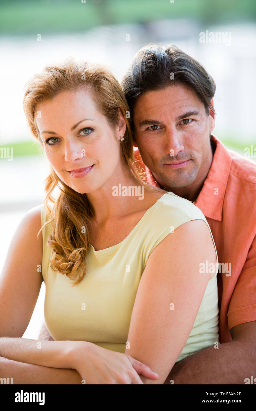 Caucasian couple hugging Stock Photo - Alamy
