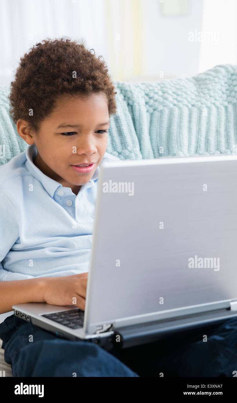 Boy typing laptop hi-res stock photography and images - Alamy