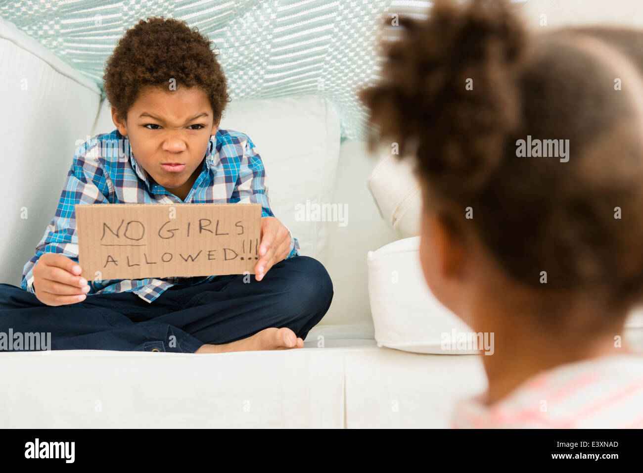 Black boy holding No girls allowed' sign for sister Stock Photo - Alamy