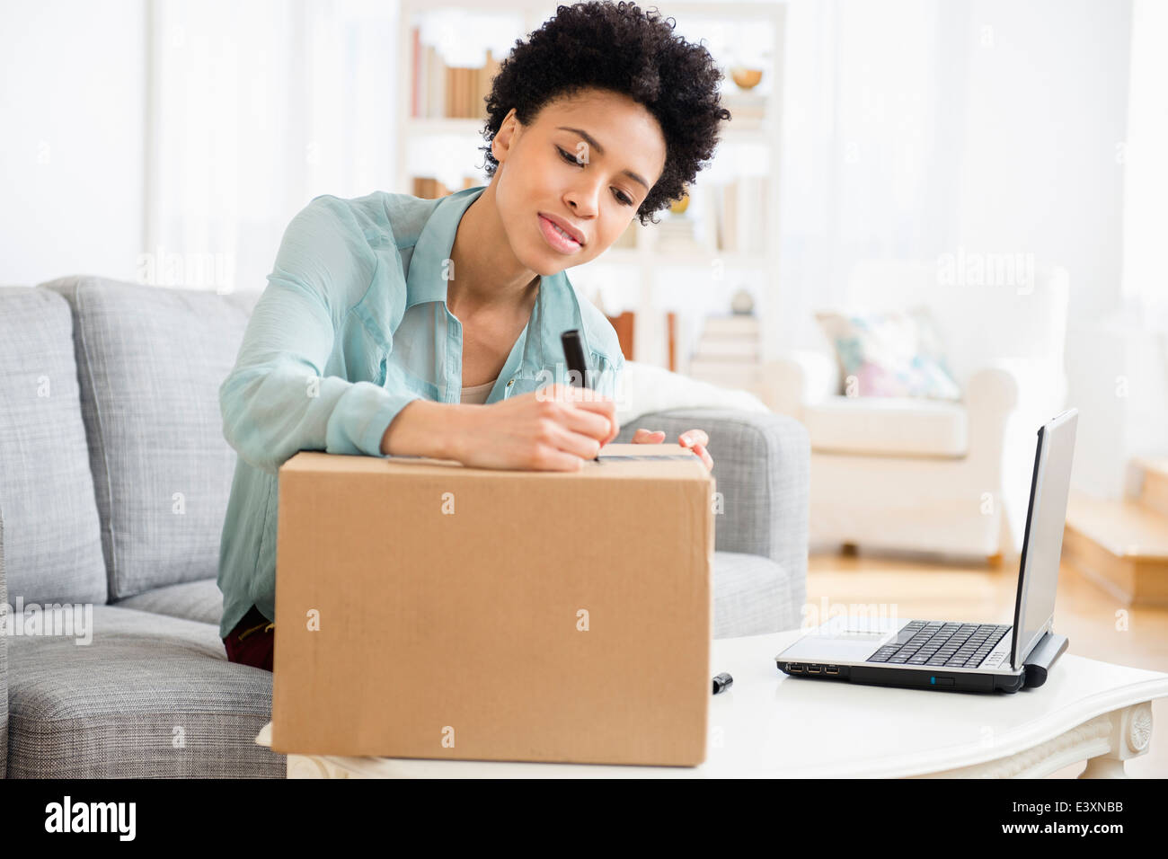 Woman package hi-res stock photography and images - Alamy