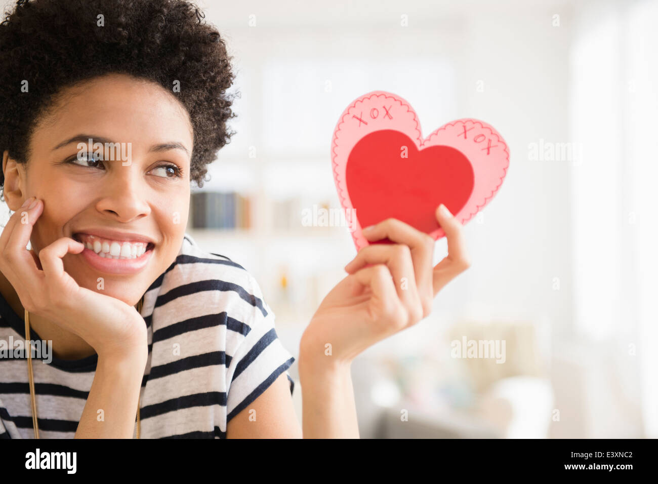 Black woman holding heart-shape Valentine Stock Photo - Alamy