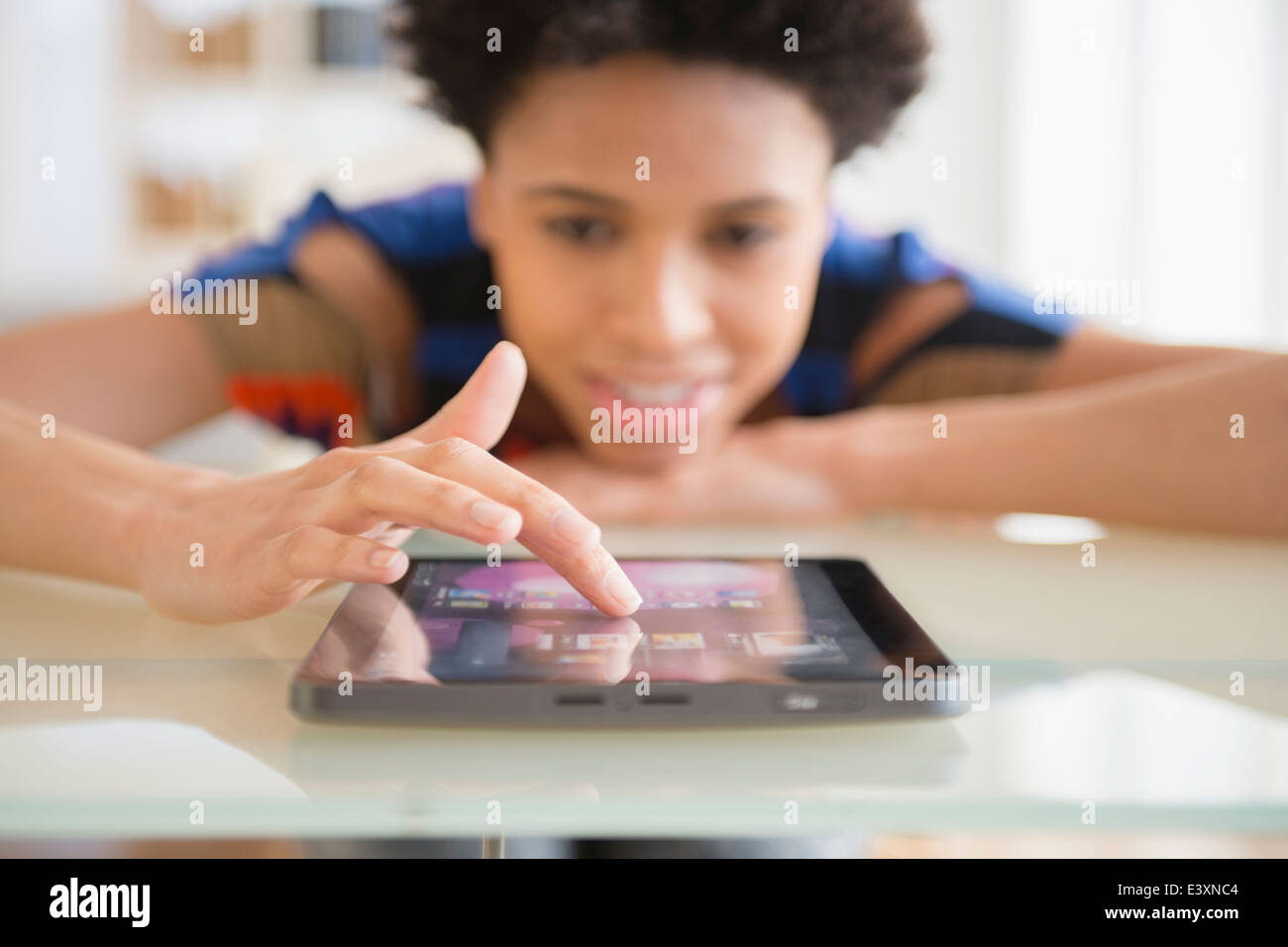 Black woman using digital tablet Stock Photo - Alamy