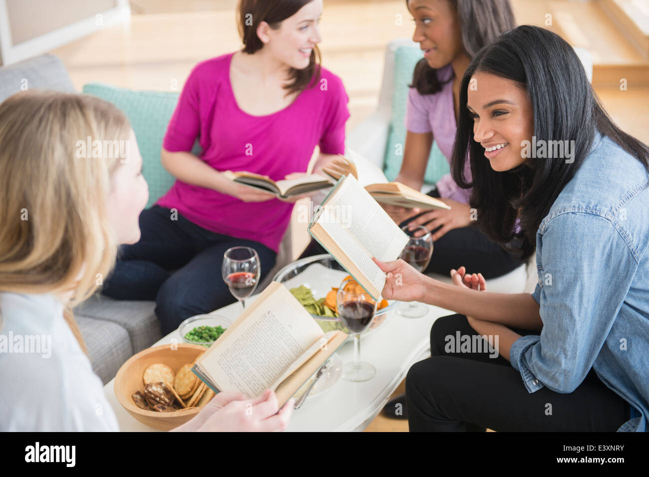 Friends discussing books together Stock Photo - Alamy