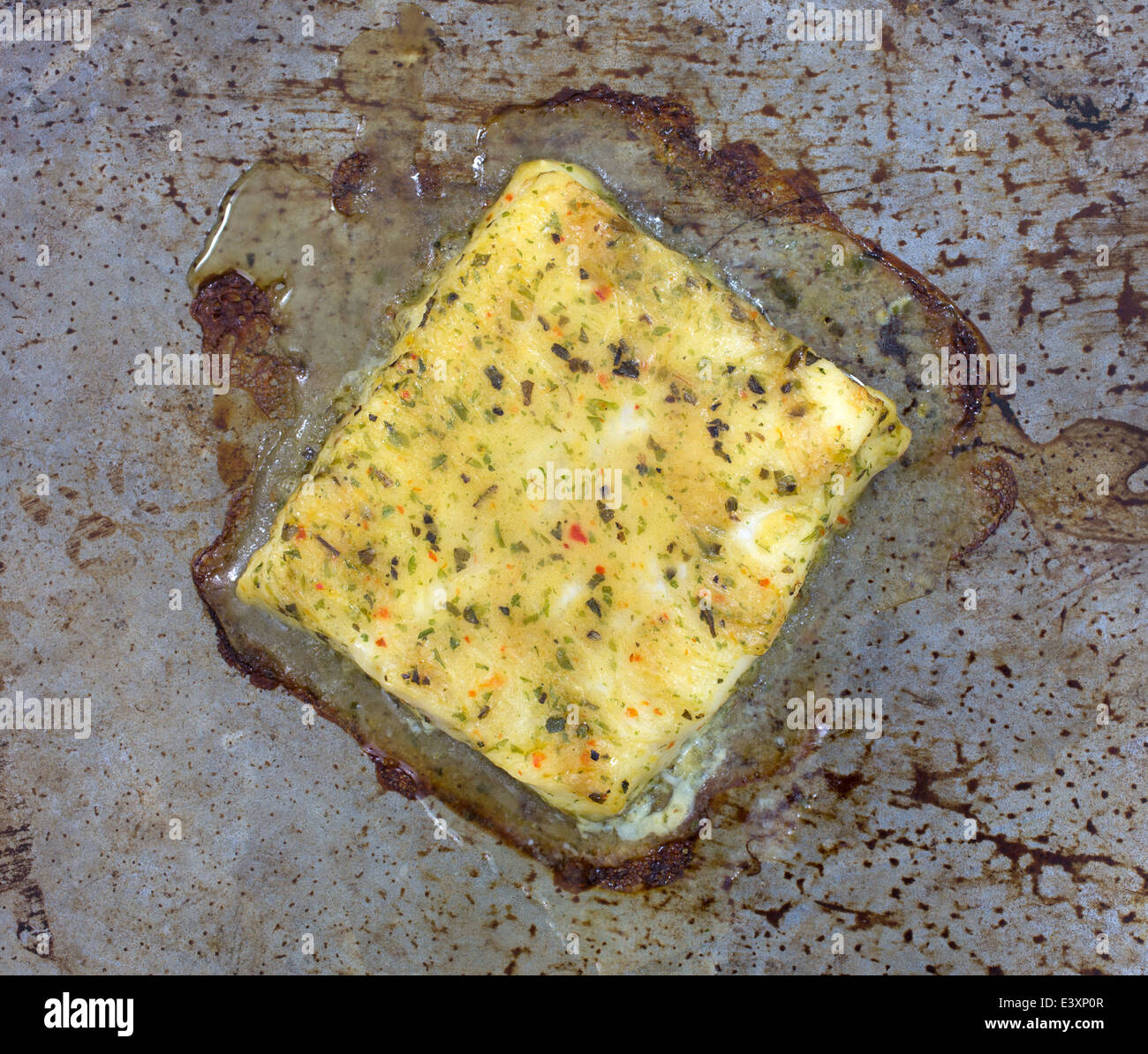 A fillet of baked Alaskan Pollock on an old pan Stock Photo - Alamy
