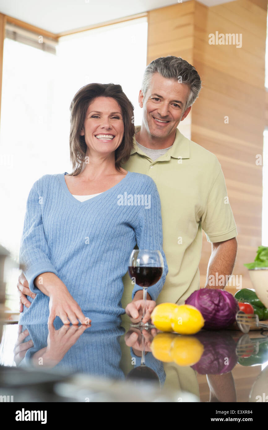 Hispanic couple cooking in kitchen Stock Photo - Alamy