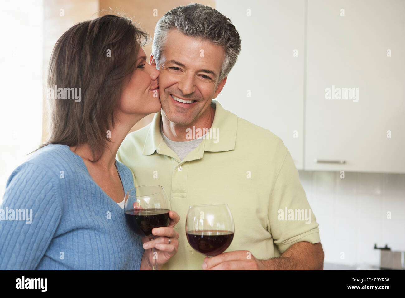 Hispanic couple having wine together Stock Photo - Alamy