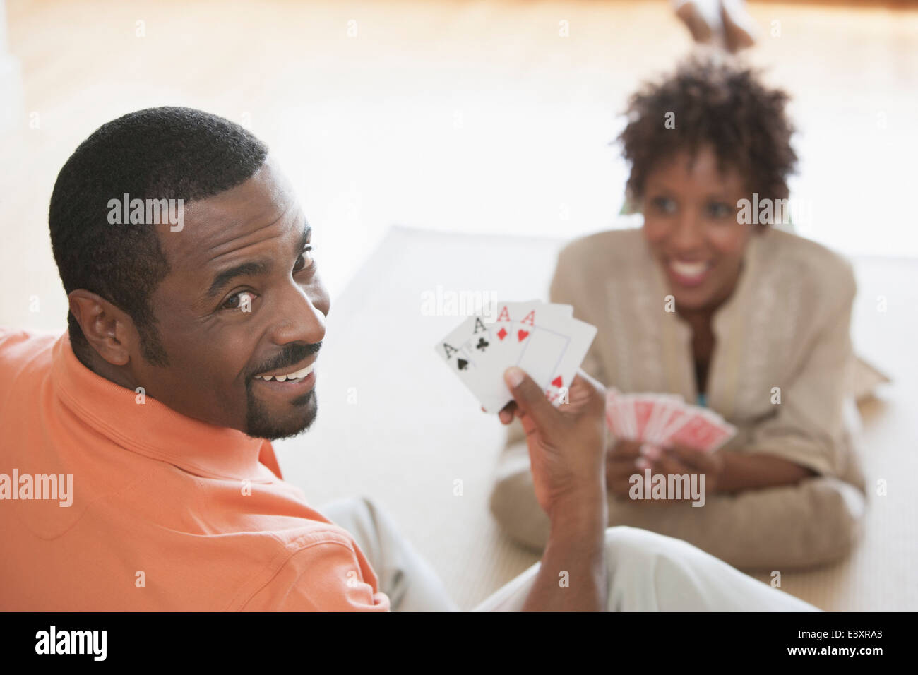 African American couple playing cards Stock Photo - Alamy