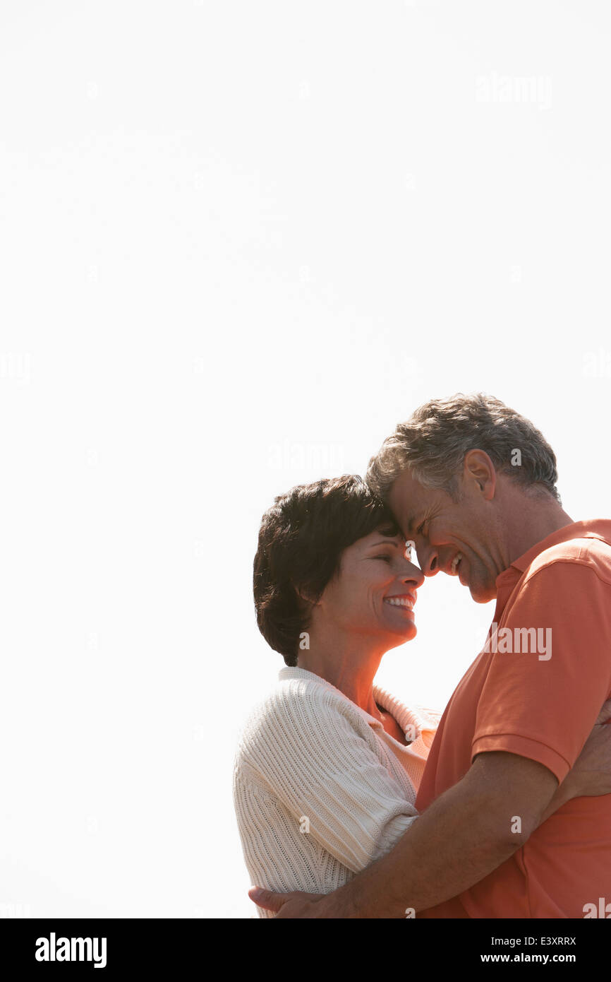 Caucasian couple hugging Stock Photo - Alamy