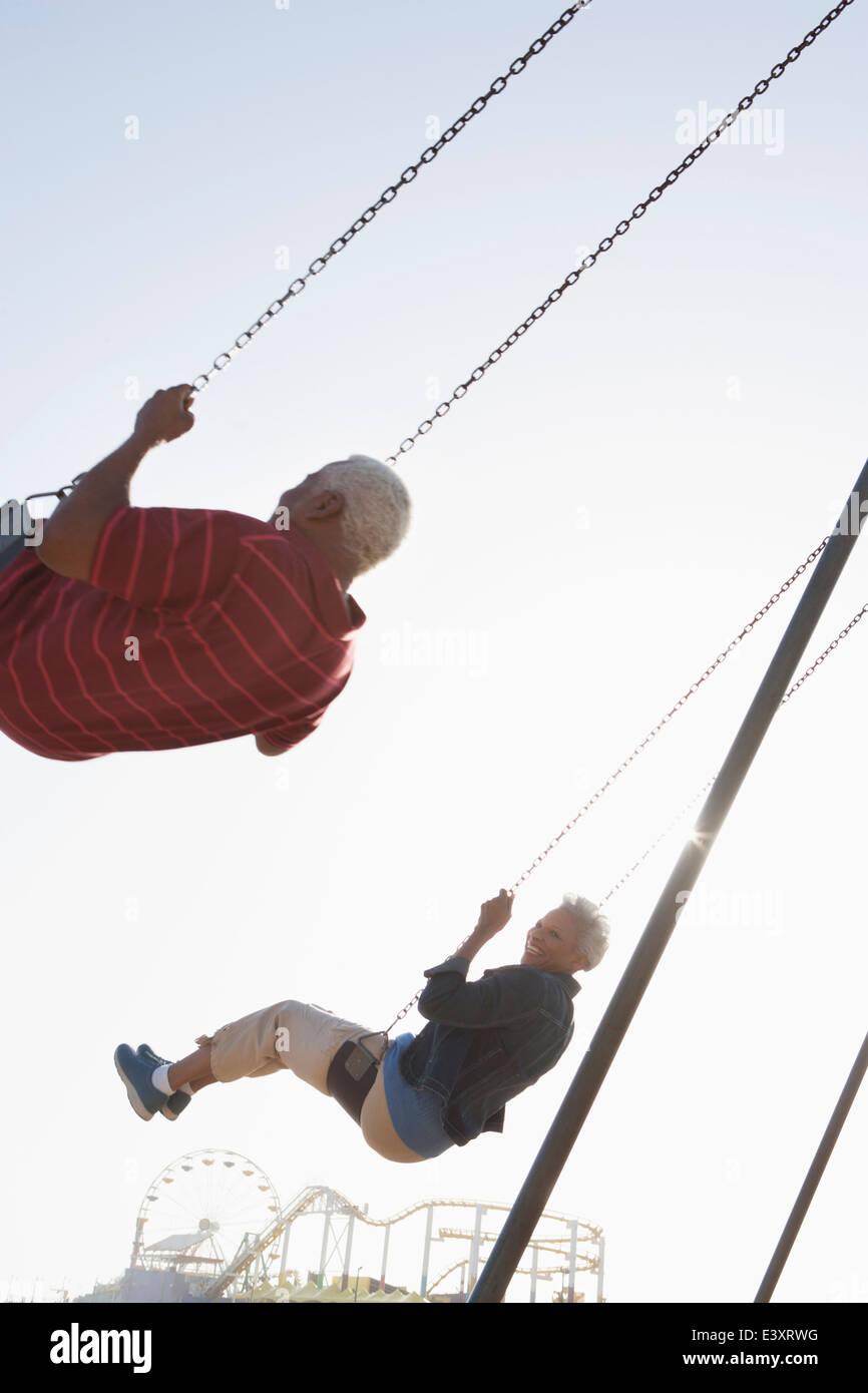 Couple on swing set hi-res stock photography and images - Alamy