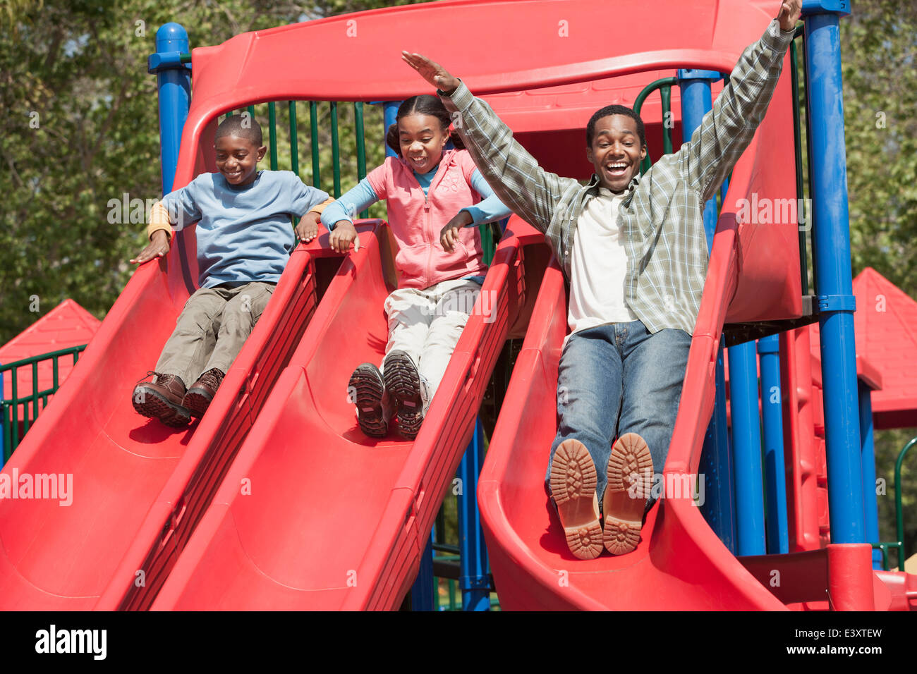 Father and children playing together at playground Stock Photo - Alamy
