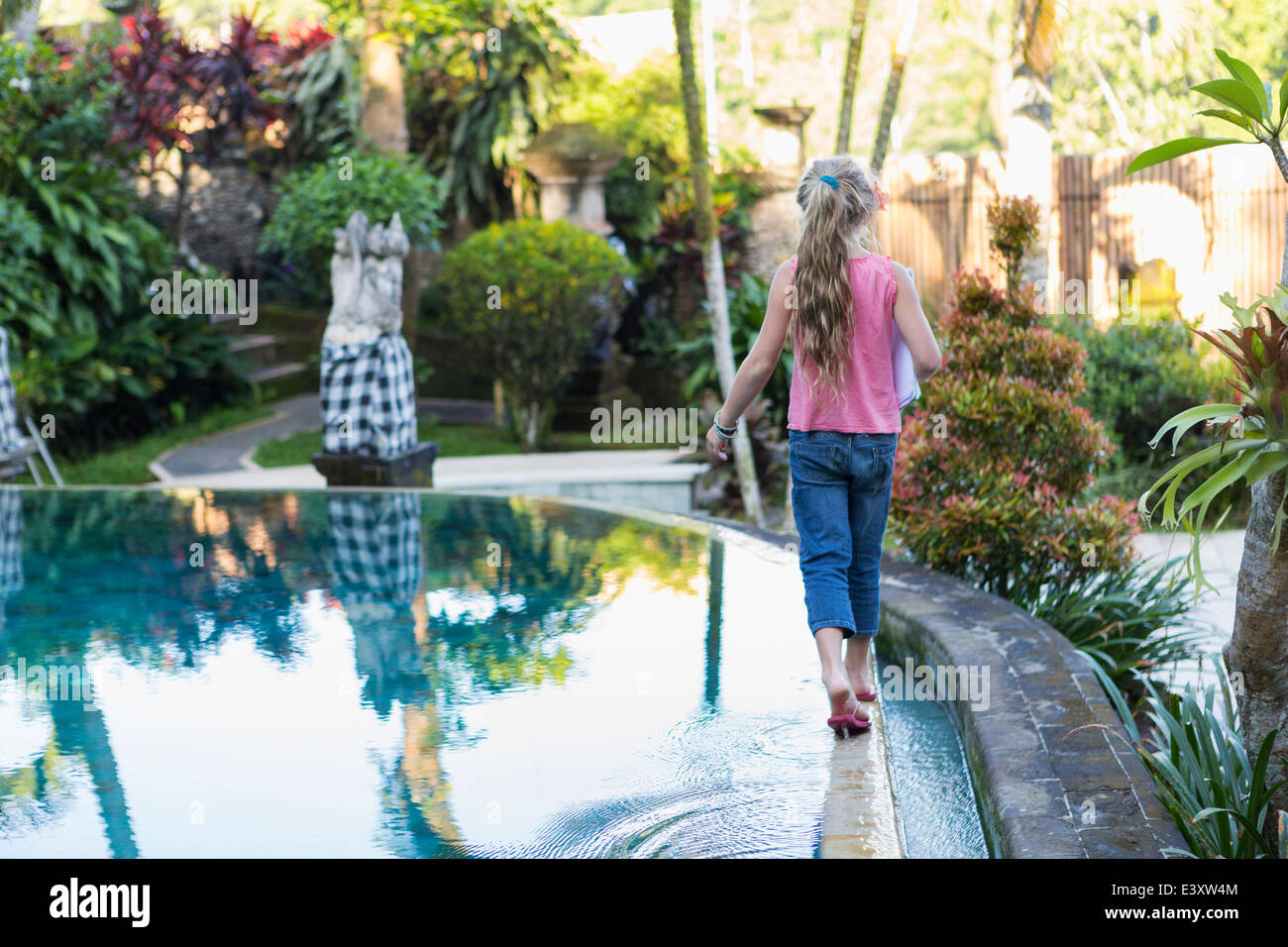 Along edge of swimming pool hi-res stock photography and images - Alamy