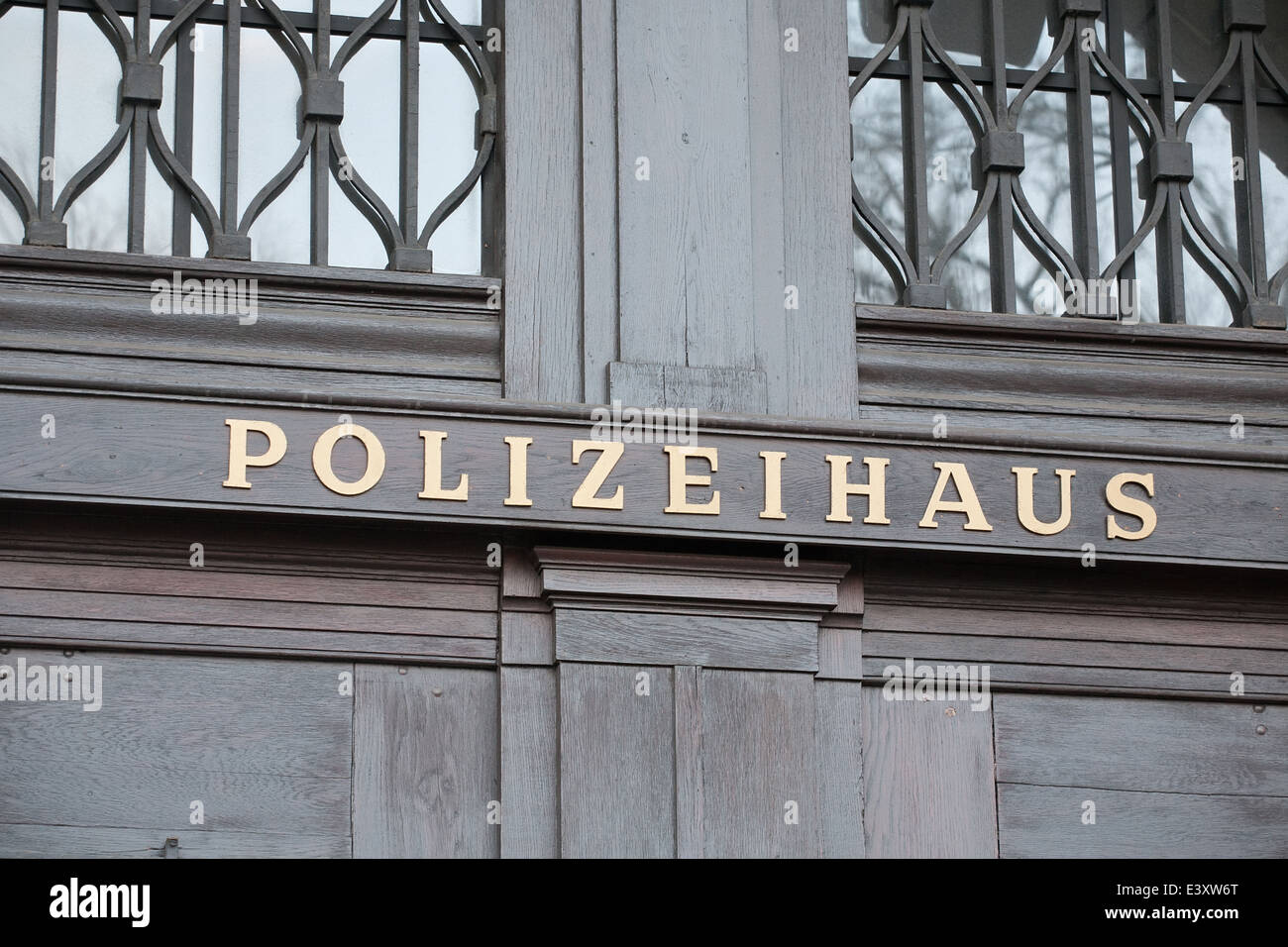 German police house signboard gold letters Stock Photo - Alamy