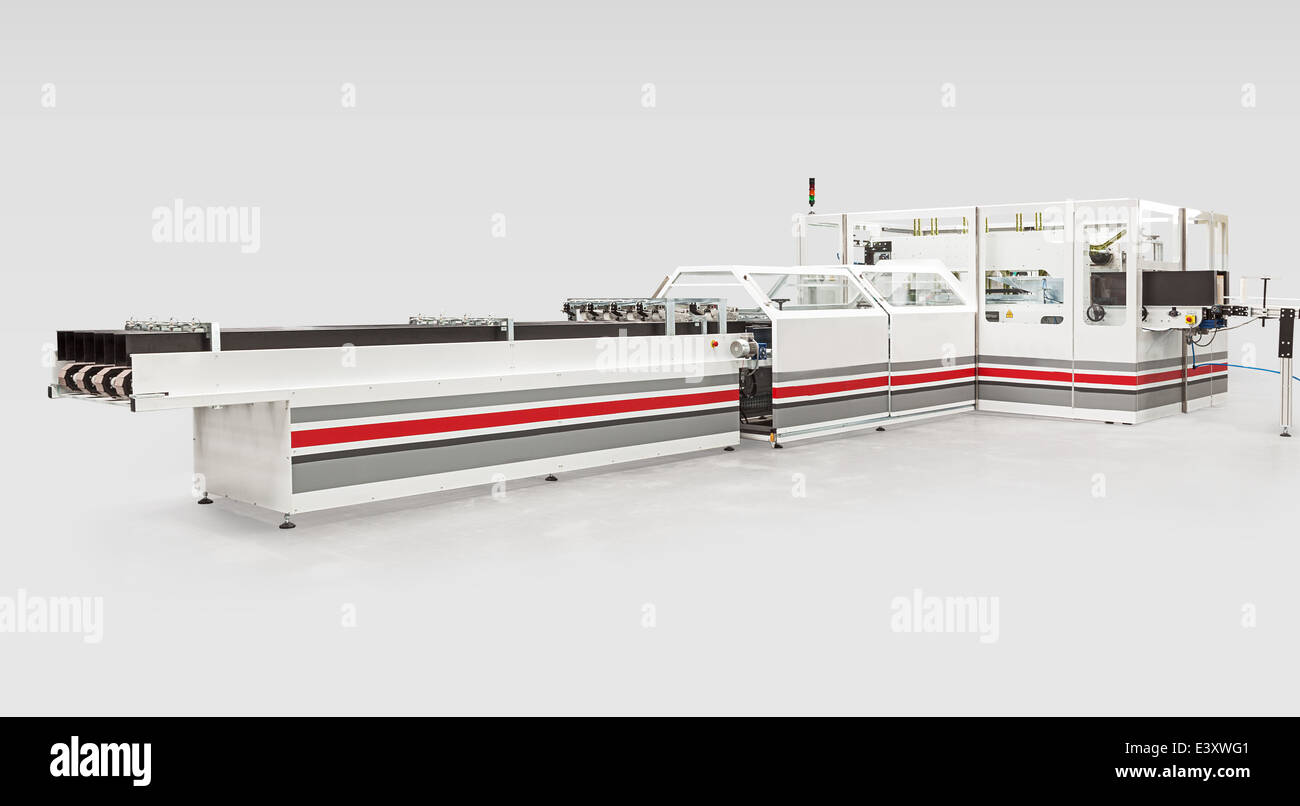 Industrial machine for napkin wrapping and packaging Stock Photo - Alamy