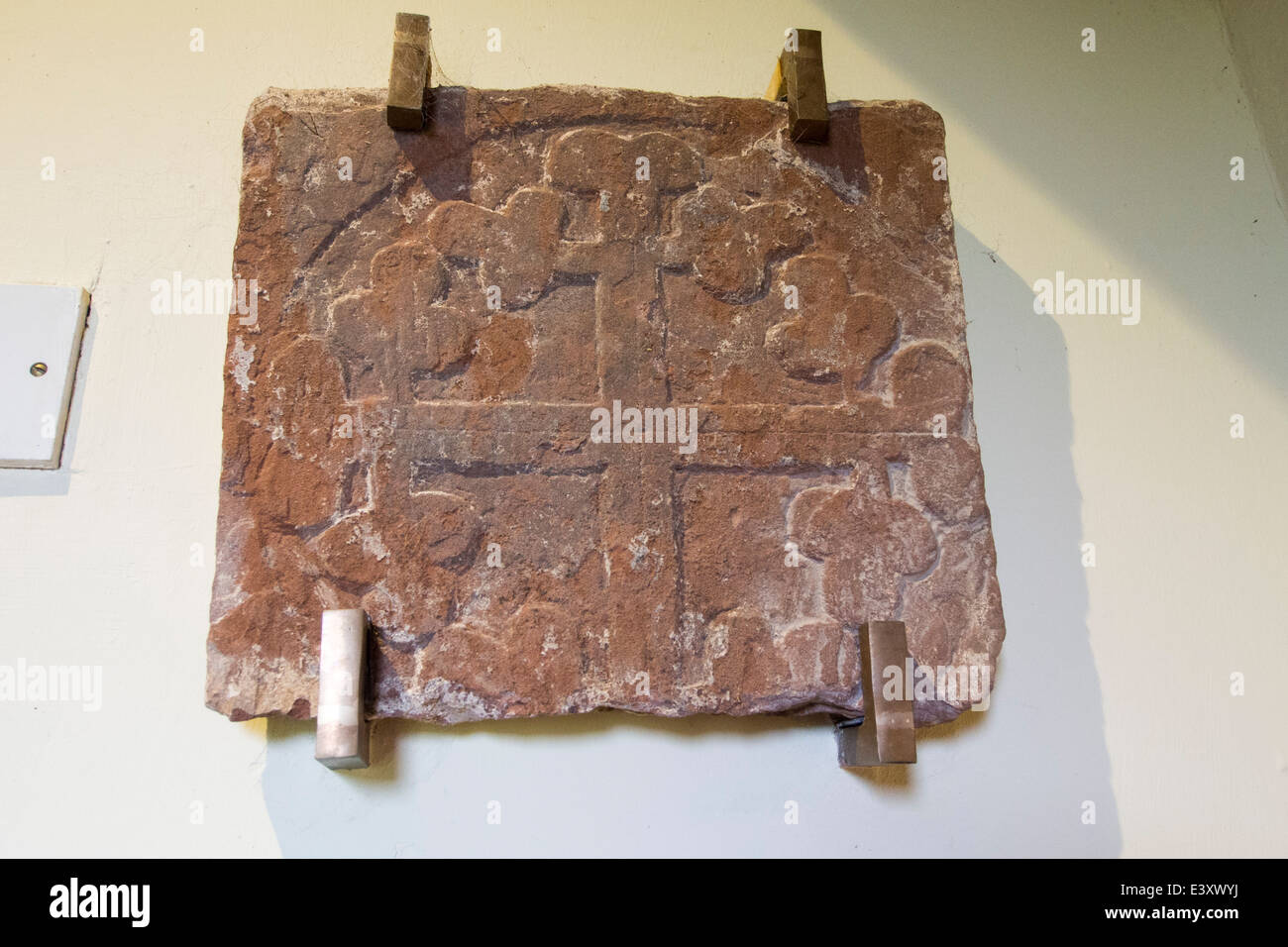 An ancient stone cross in the Church of St. Michael; Addingham, Cumbria ...
