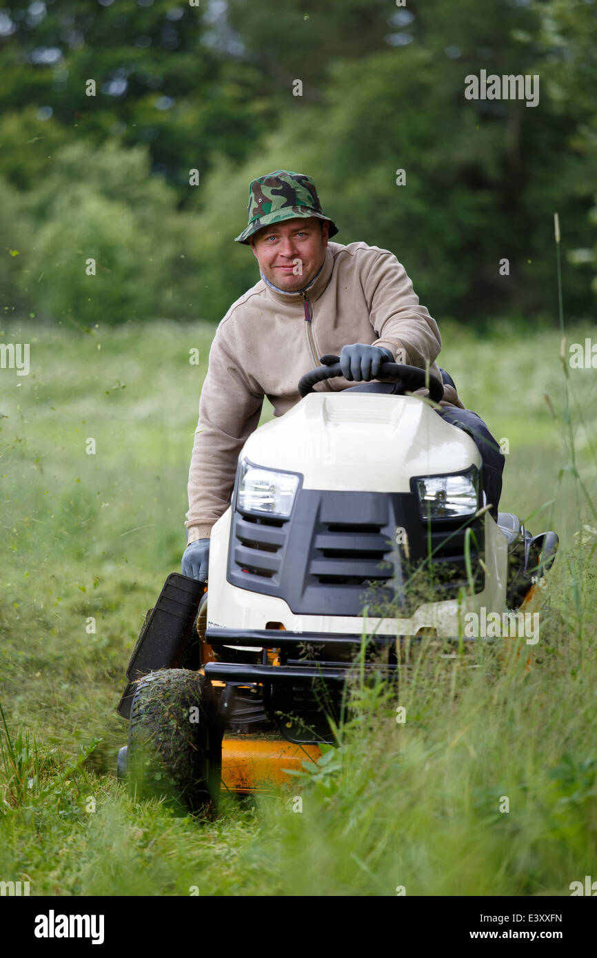 man with lawn mower Stock Photo - Alamy