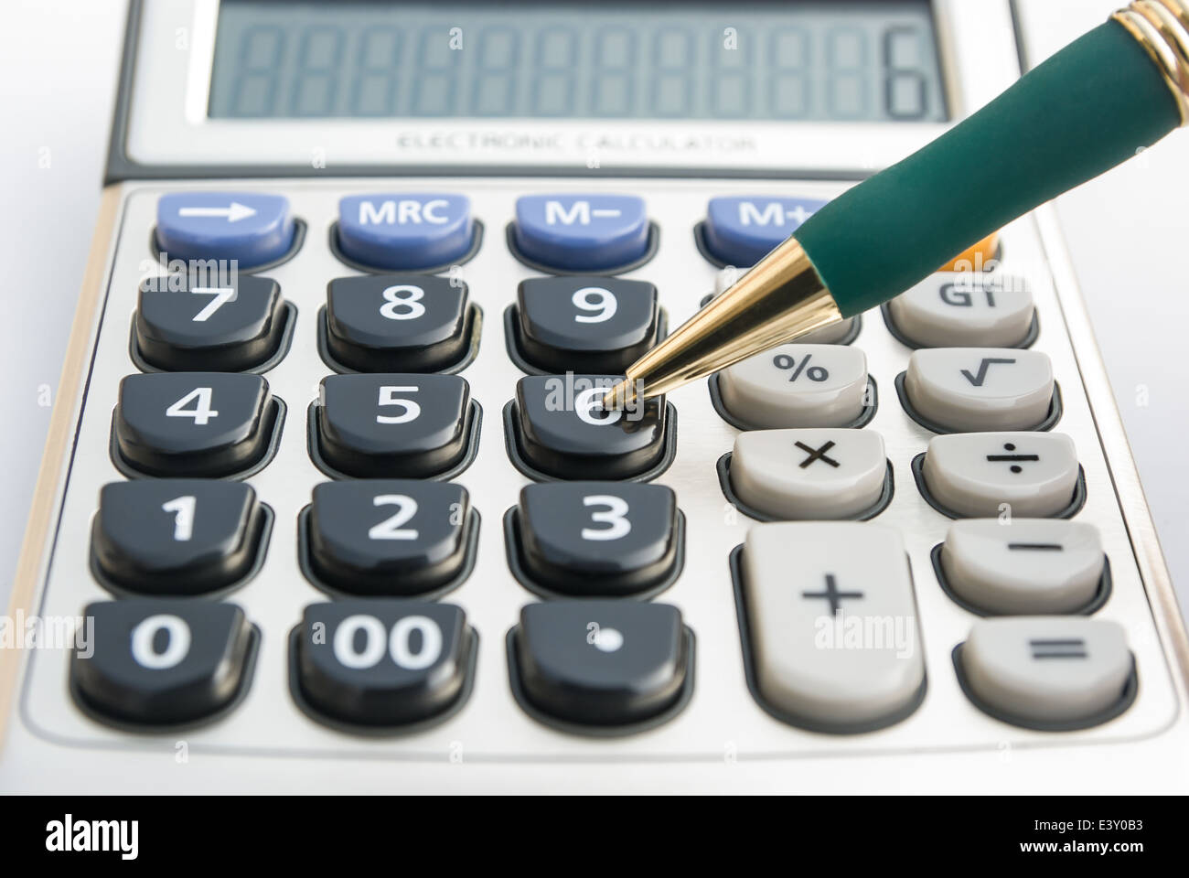calculator and a ballpoint Stock Photo - Alamy