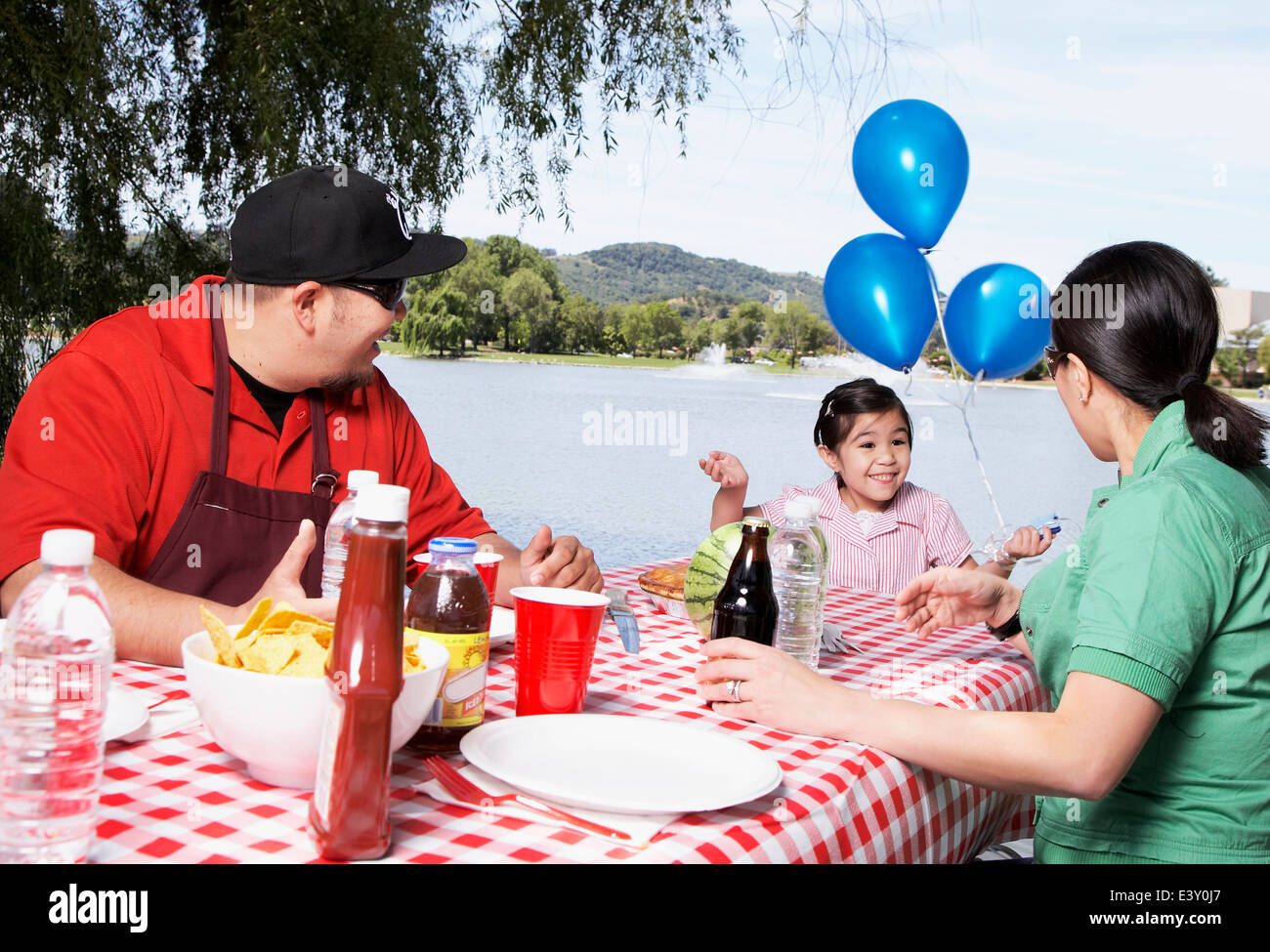 Family eating together at picnic Stock Photo - Alamy