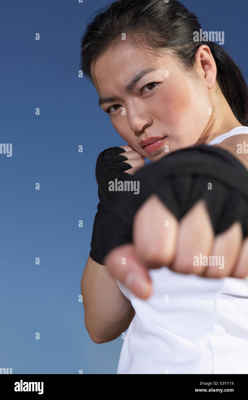 Chinese woman kick boxing outdoors Stock Photo - Alamy