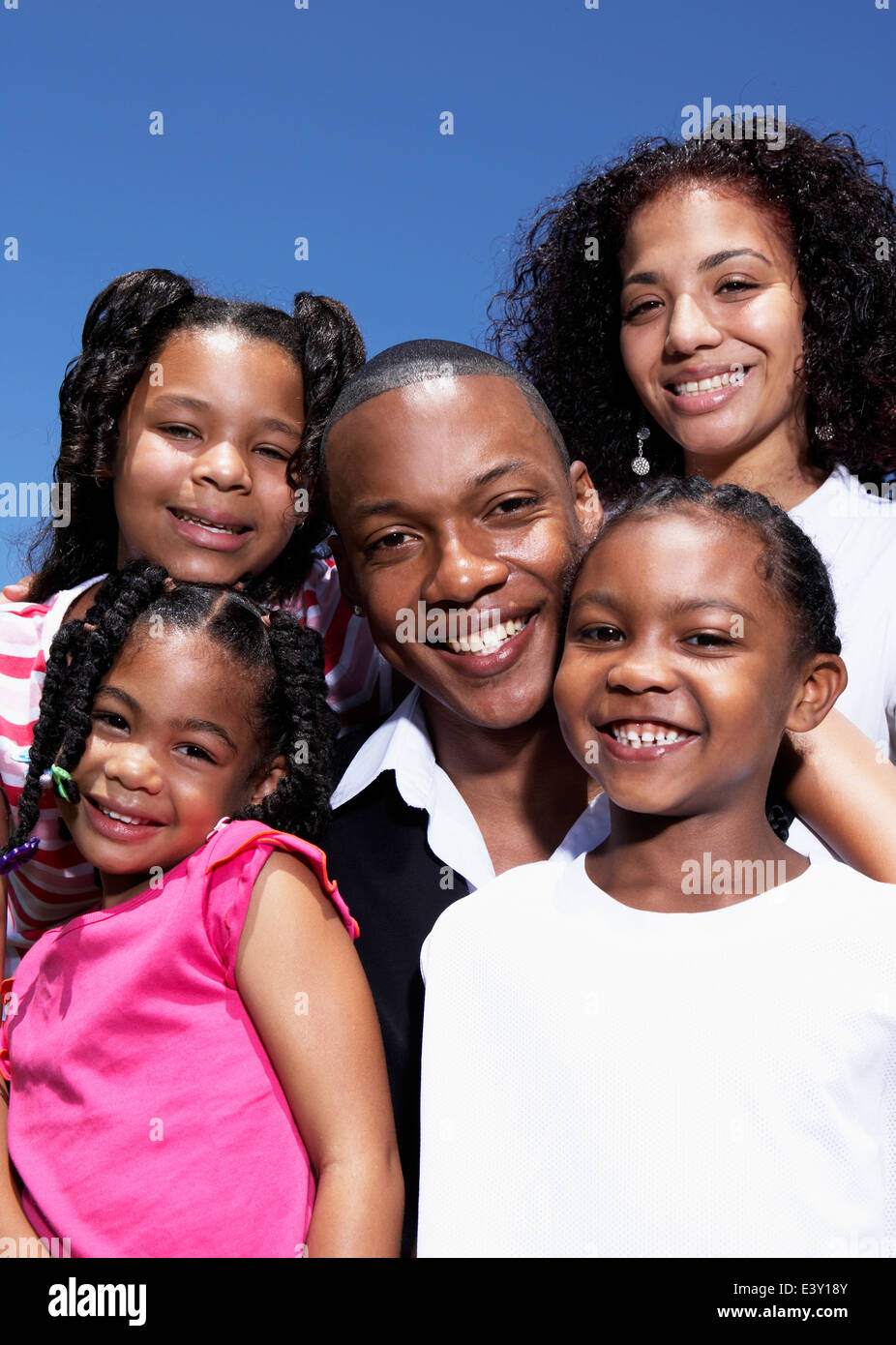 Family smiling together outdoors Stock Photo - Alamy