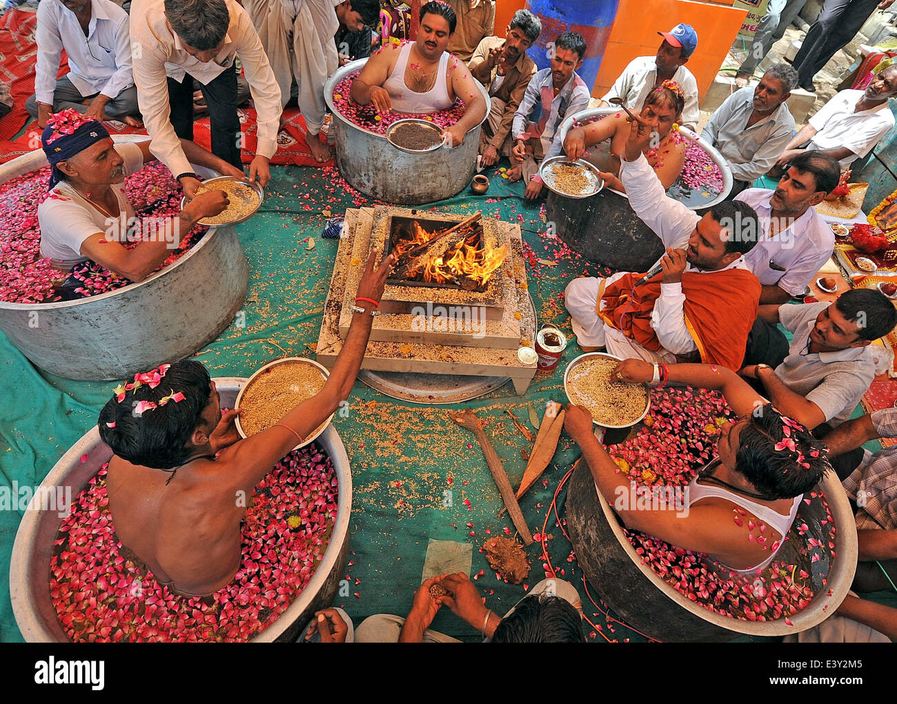 Ahmadabad, India. 1st July, 2014. Indian priests sitting in vessels ...