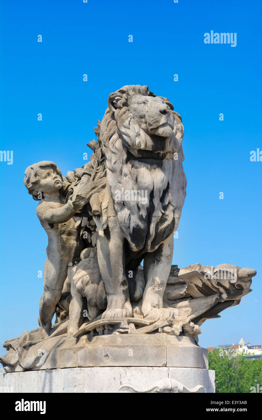Statue in Paris, France with a lion and a boy Stock Photo - Alamy
