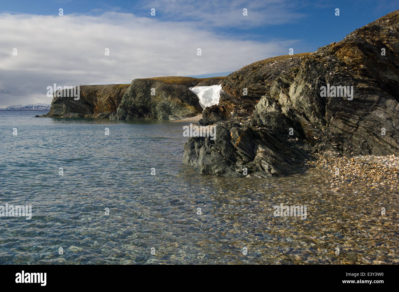 Pebble beach at the foot of Alkhornet, Isfjorden, Spitsbergen, Svalbard ...