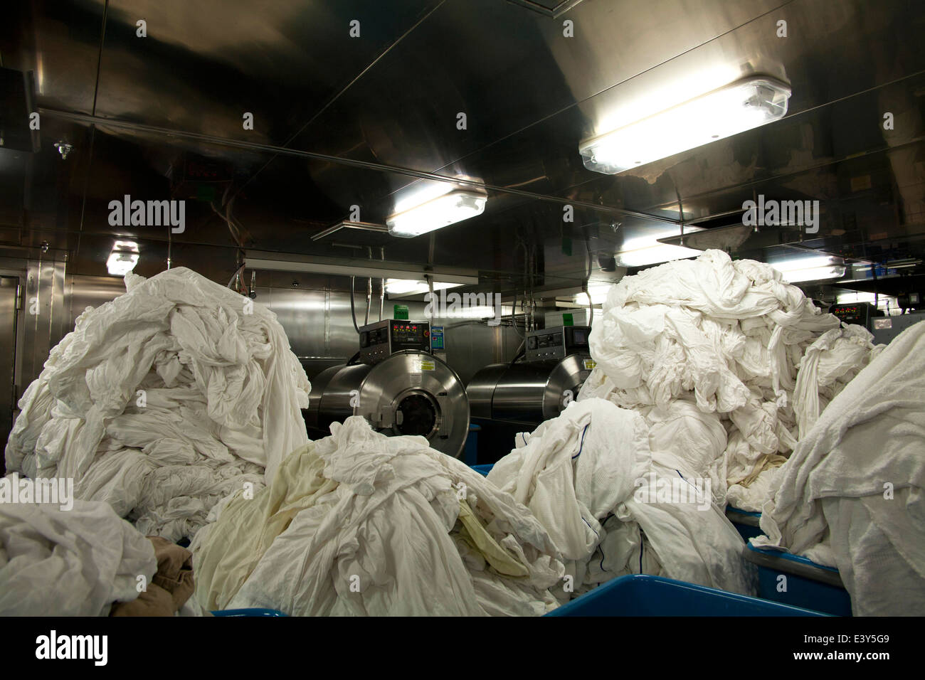 Laundry facility full of dirty sheets in the bowls of a cruise ship ...