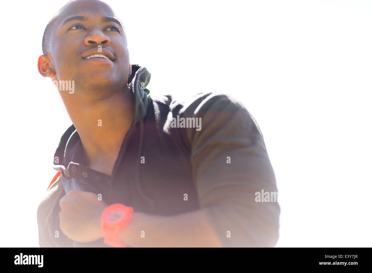 Low angle portrait of smiling young man Stock Photo - Alamy