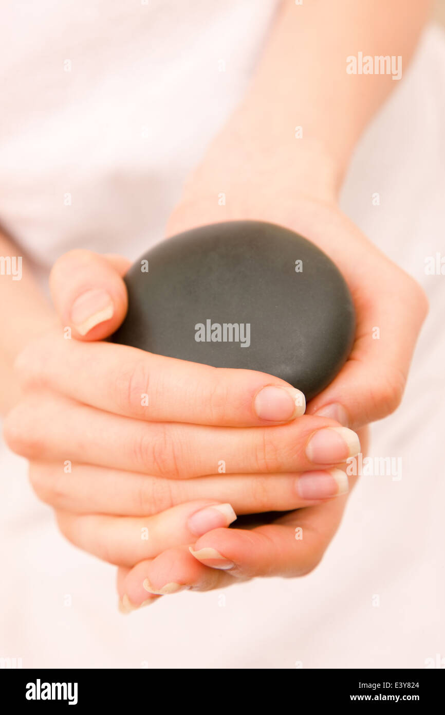 Woman holding stone hi-res stock photography and images - Alamy
