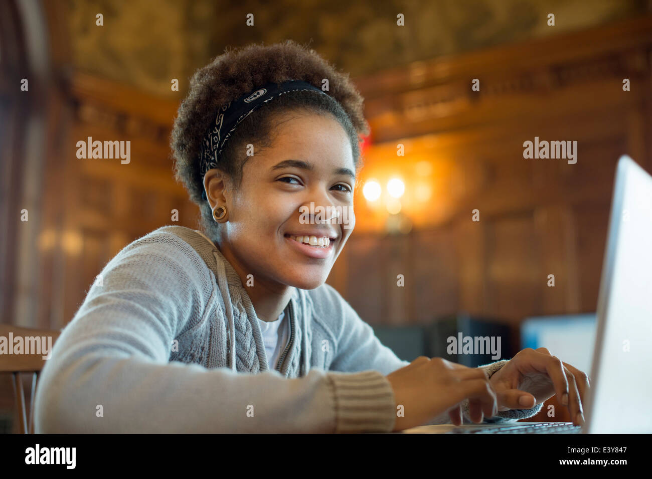 Young woman using laptop Stock Photo - Alamy